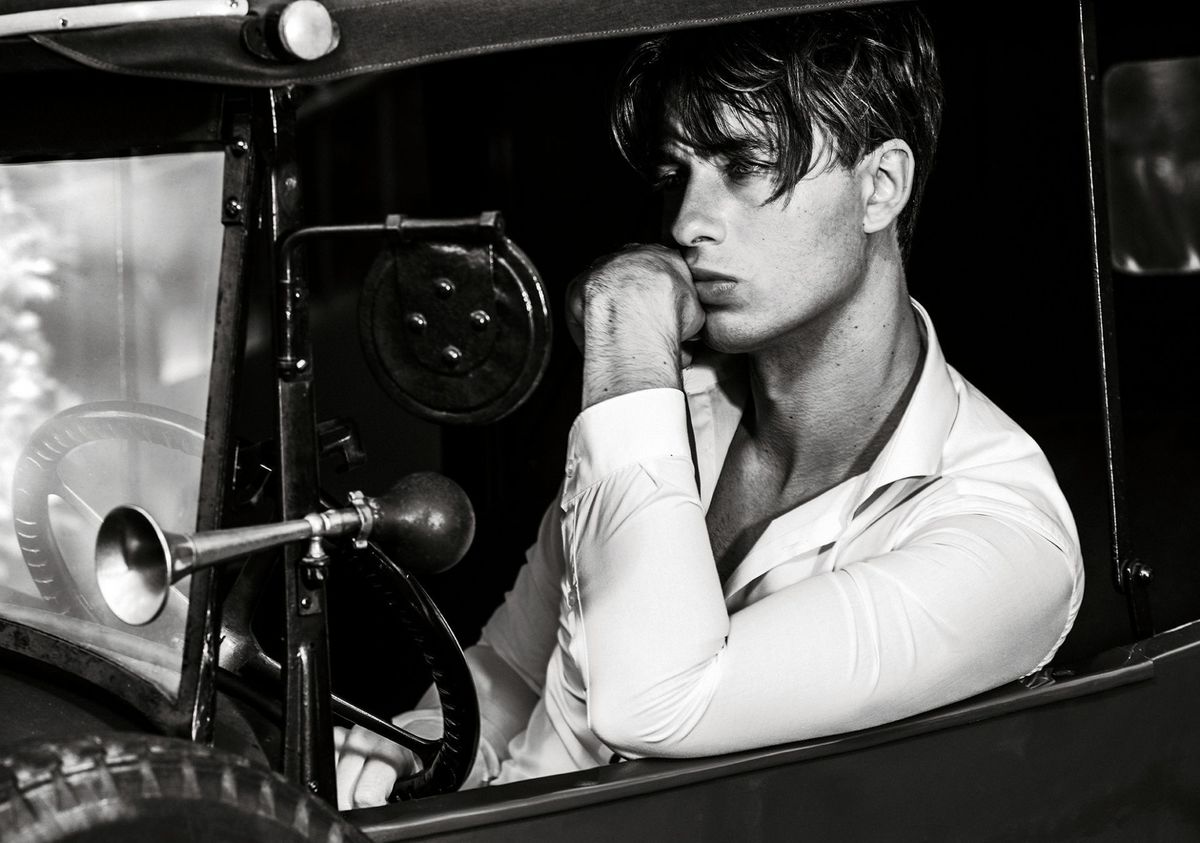 A young man in a classic car by Eric Ouaknine | Buy Art Online | Rise Art